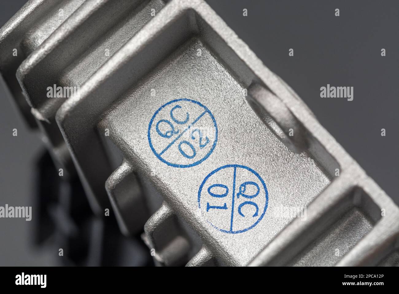 QC / Quality control stamp on a Chinese unbranded die-cast aluminium DC ...