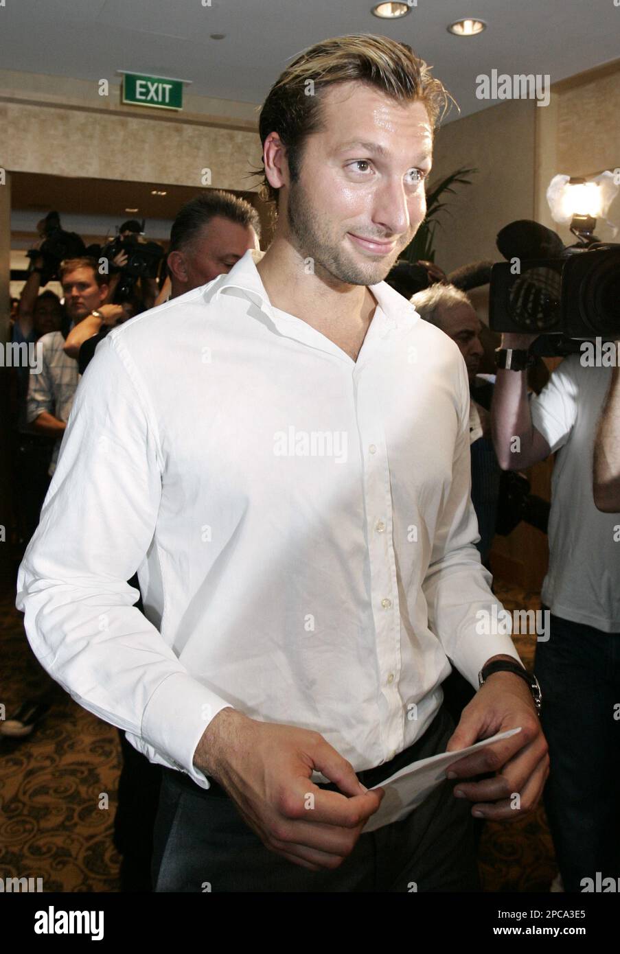 Five-time Olympic champion Ian Thorpe leaves a press conference in ...