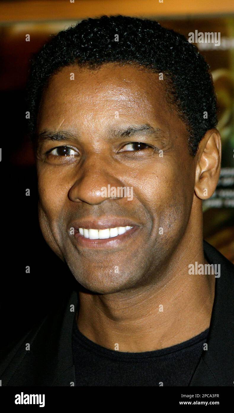 Denzel Washington poses for photographers during red-carpet arrivals to ...