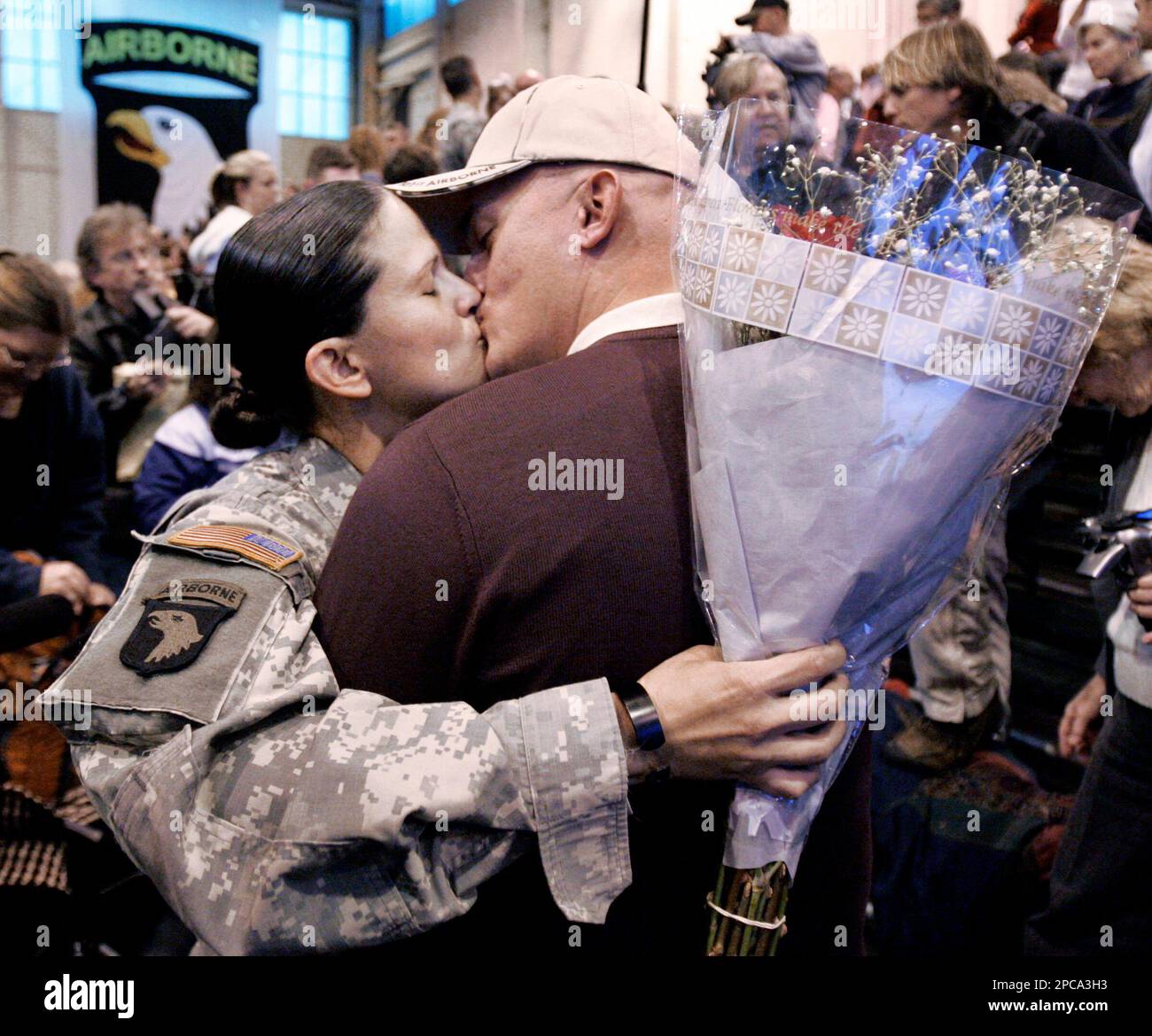 1st Lt. Rosanna Vasquez Brown kisses her husband, Master Sgt. Mark ...