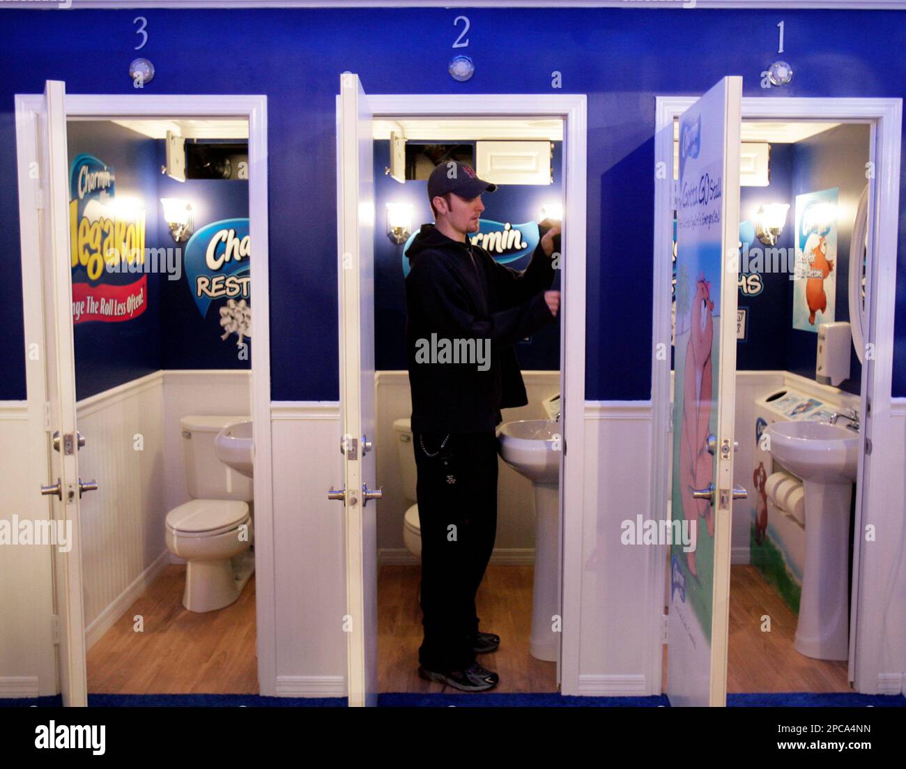 Neil Rinden prepares the bathroom stalls that will be open for the ...