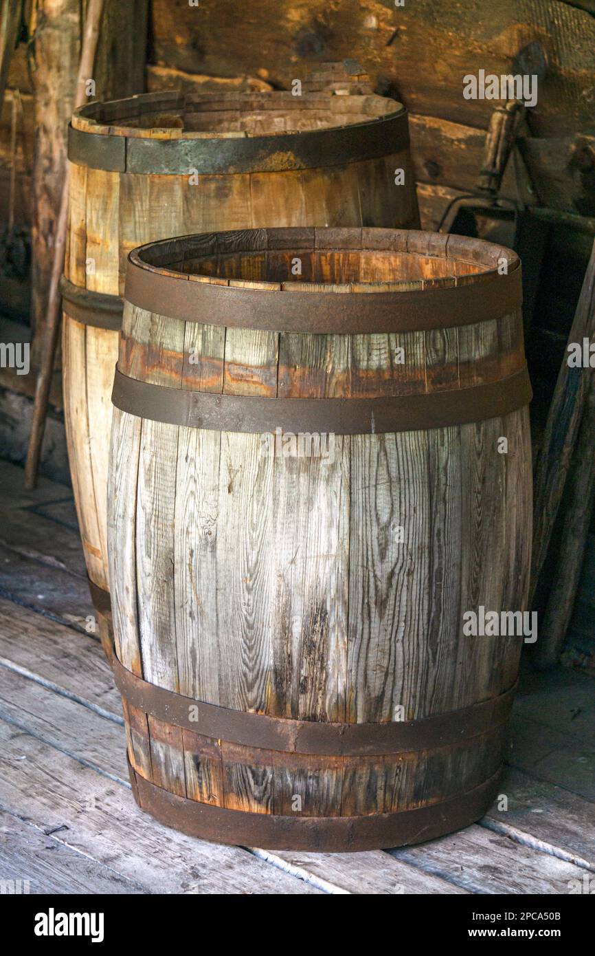 Two old wooden barrels with iron rims for food storage Stock Photo - Alamy