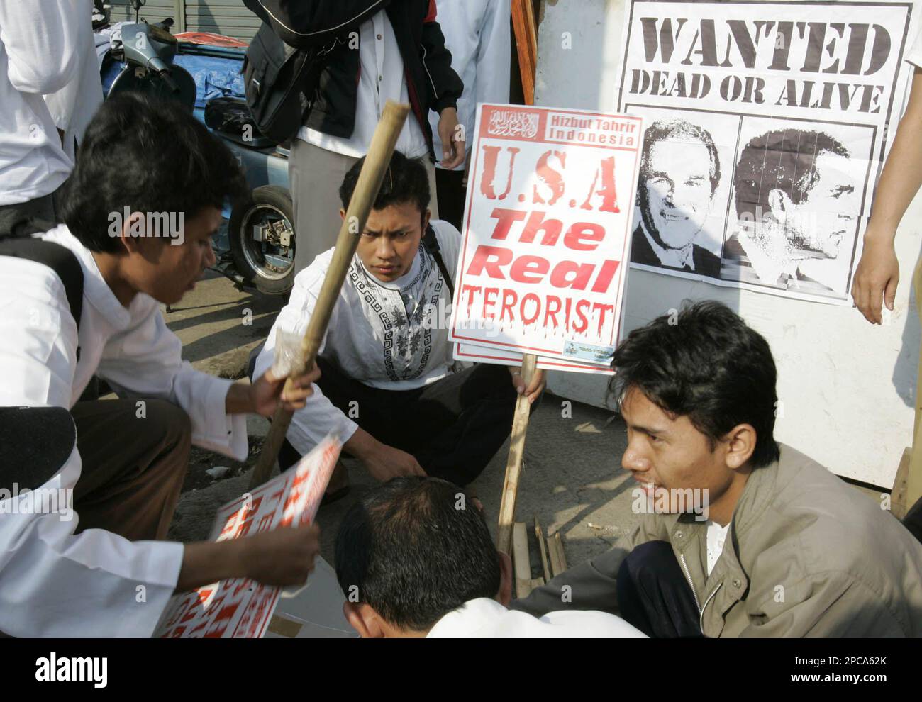 Members of an Indonesian Muslim group prepare signs for a protest ...