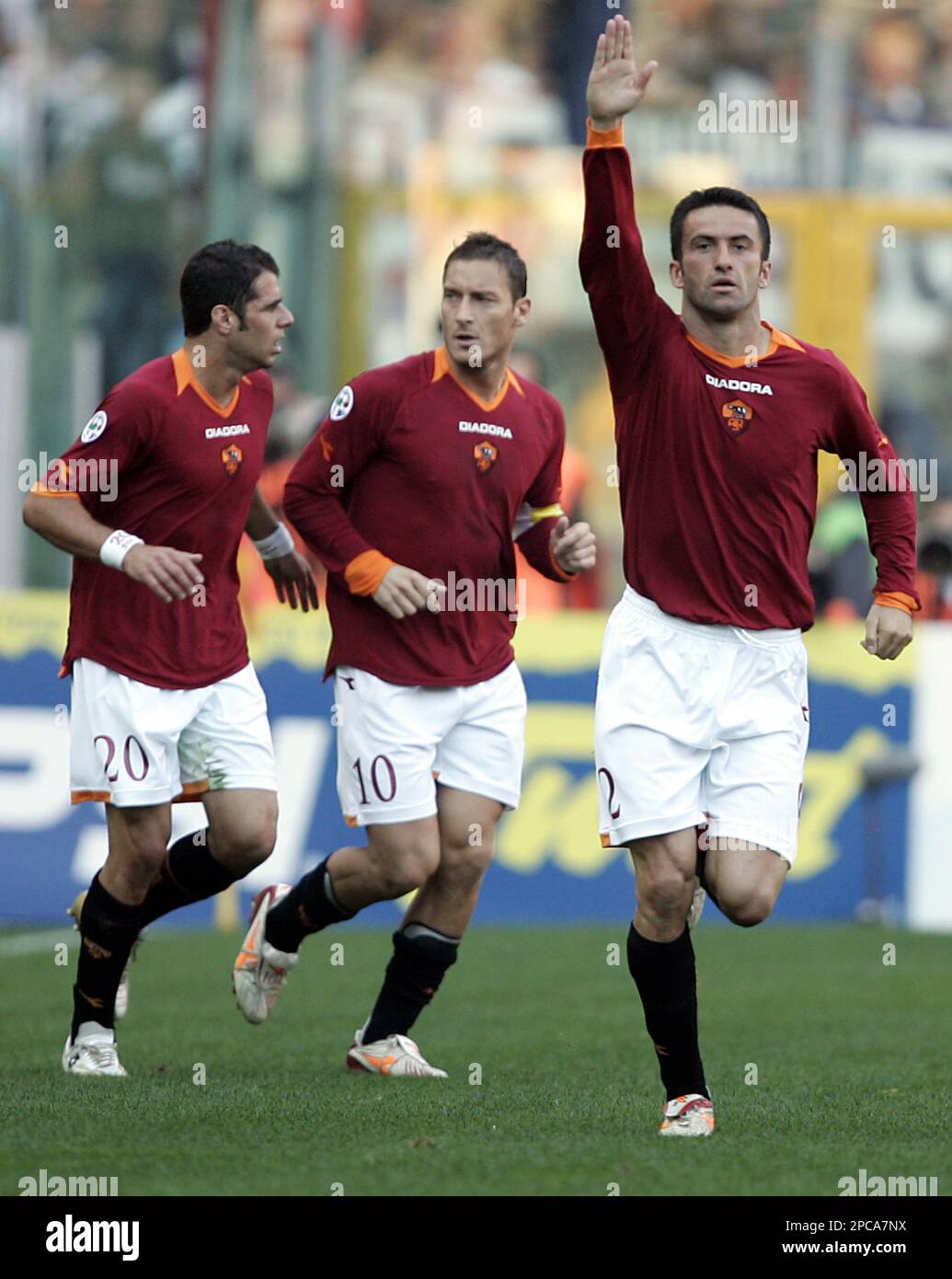 AS Roma's Christian Panucci, right, celebrates after scoring during the ...
