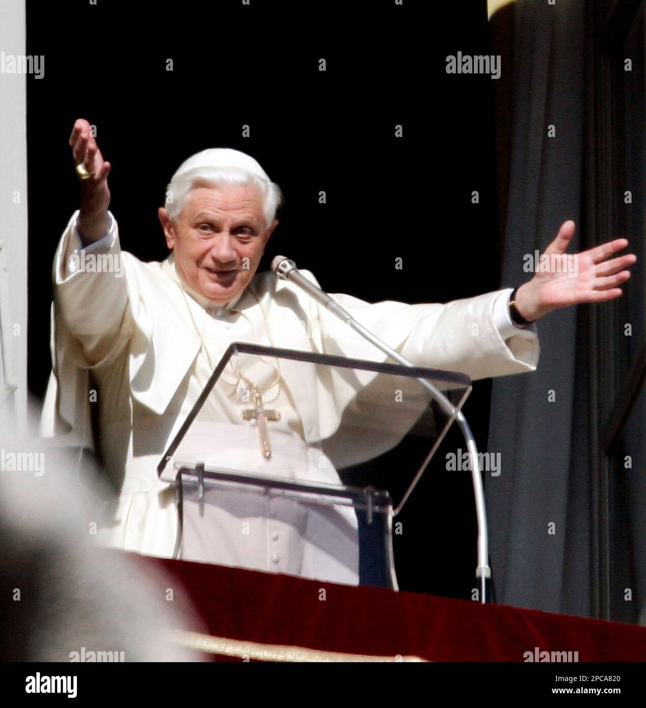 Pope Benedict XVI waves to faithful and pilgrims from the window of his ...