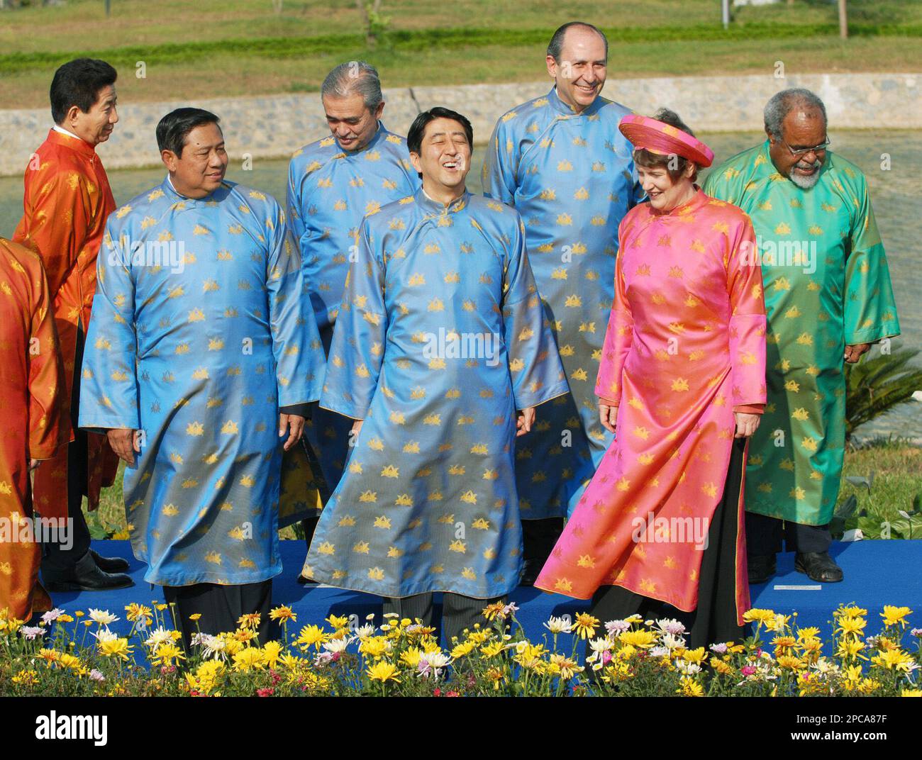 Dressed in traditional "ao dai," Japanese Prime Minister Shintaro Abe ...