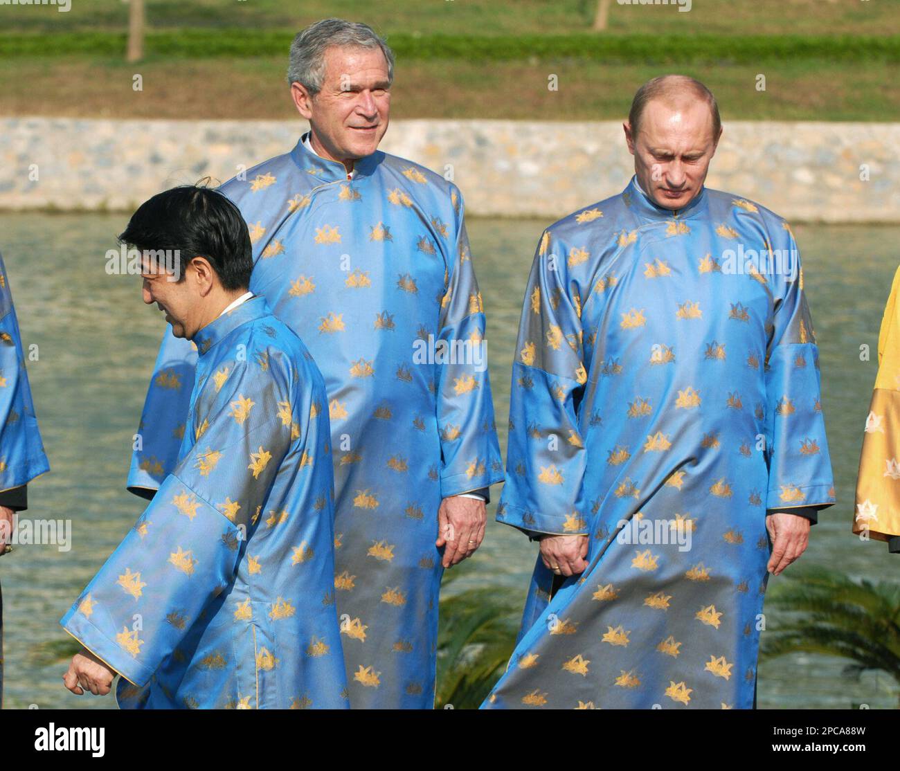Dressed in traditional "ao dai," Japanese Prime Minister Shintaro Abe ...