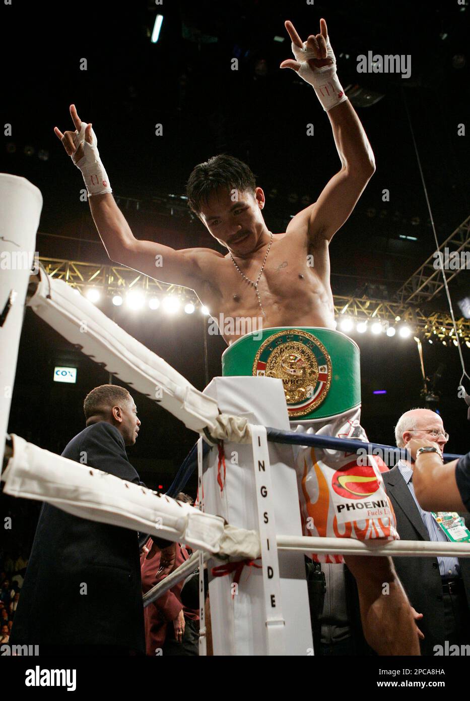 Manny Pacquiao, top, of the Philippines, pays racknowledges the fans ...