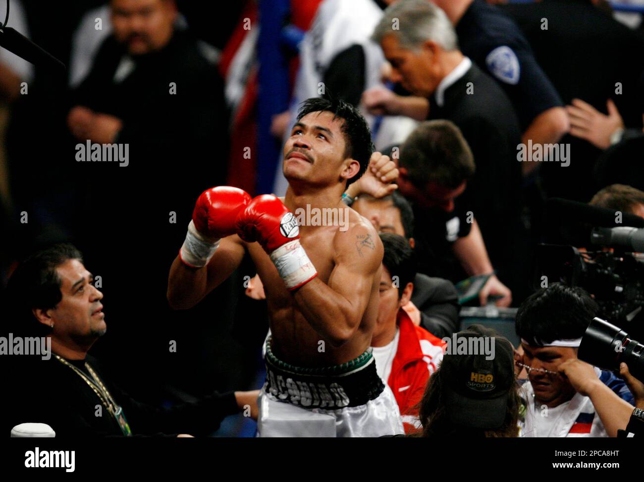 Manny Pacquiao, of the Philippines, looks skyward following his third ...