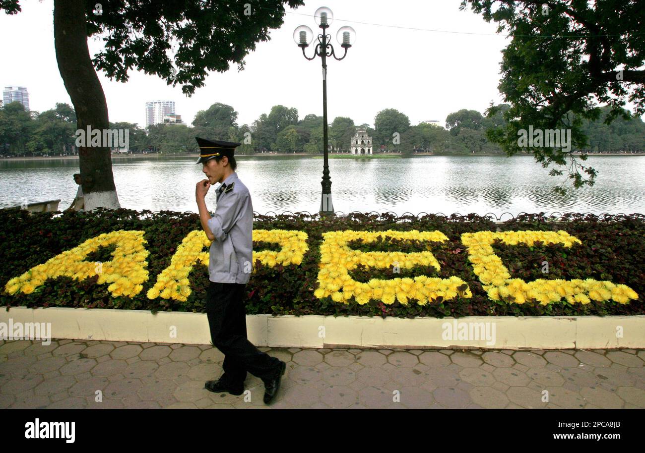 A Vietnamese security guard patrols a city park in Hanoi, Vietnam ...