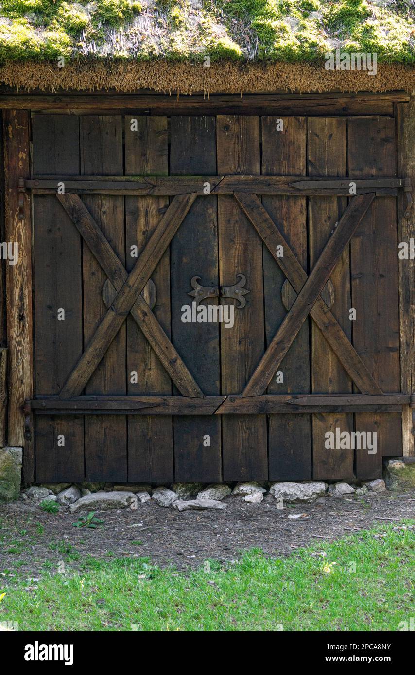Massive makeshift wooden gates, a fragment of an old estate Stock Photo ...