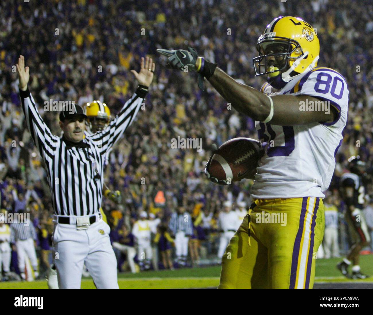 Louisiana State receiver Dwayne Bowe points to the stands after his ...