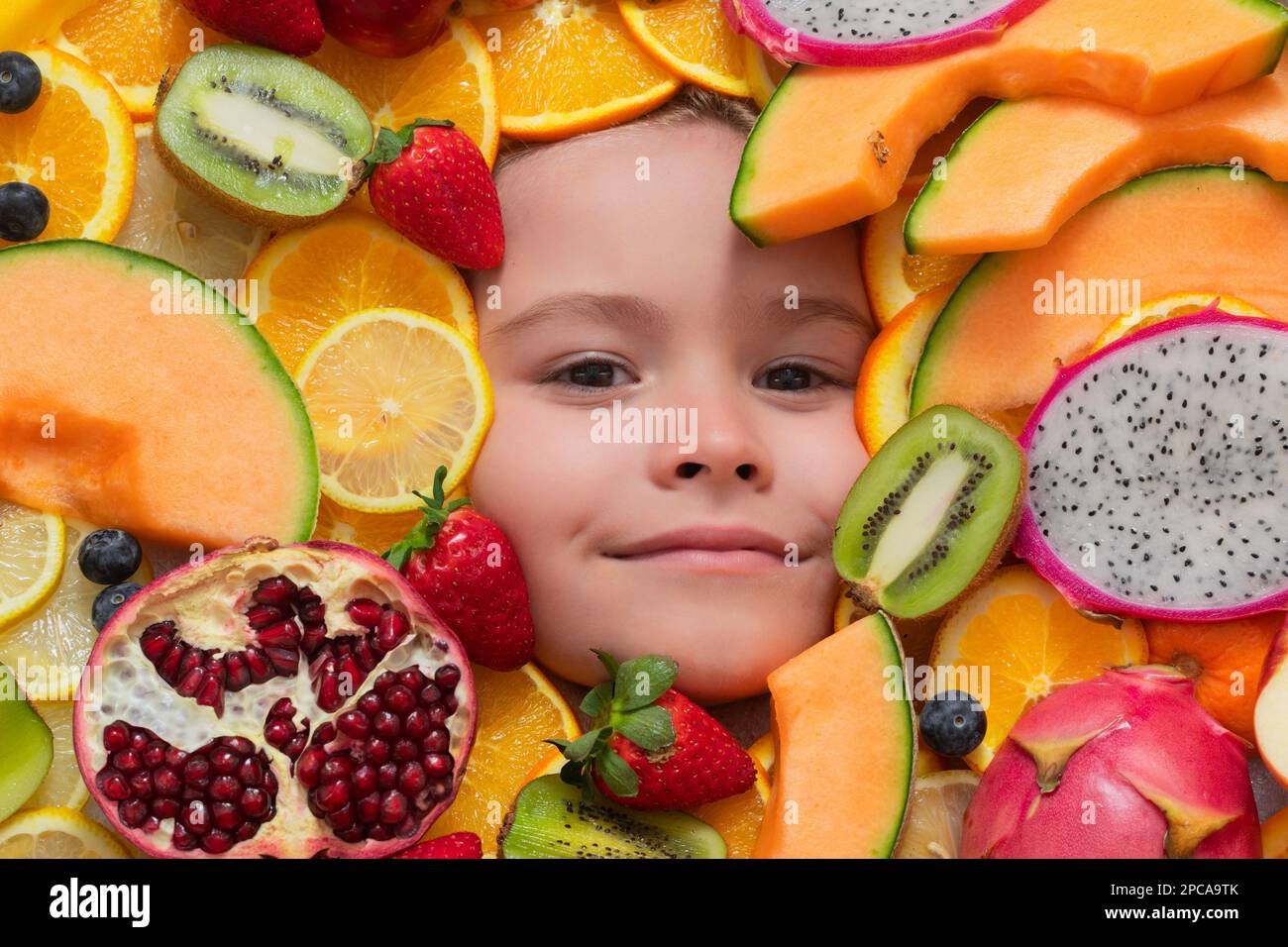 Top view of smiling kids face with different fruits. Summer fruits ...
