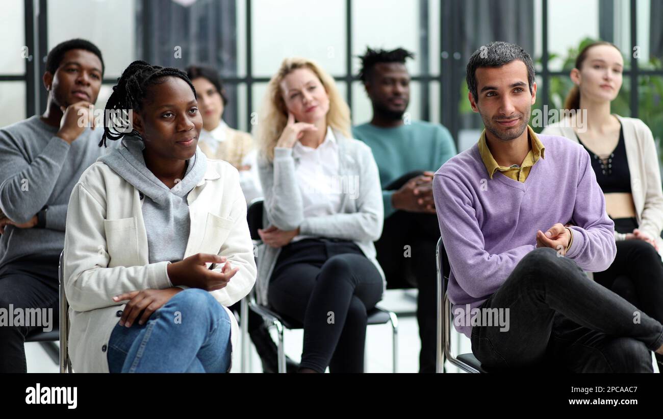 young people shaking hands in a circle of like-minded people Stock ...