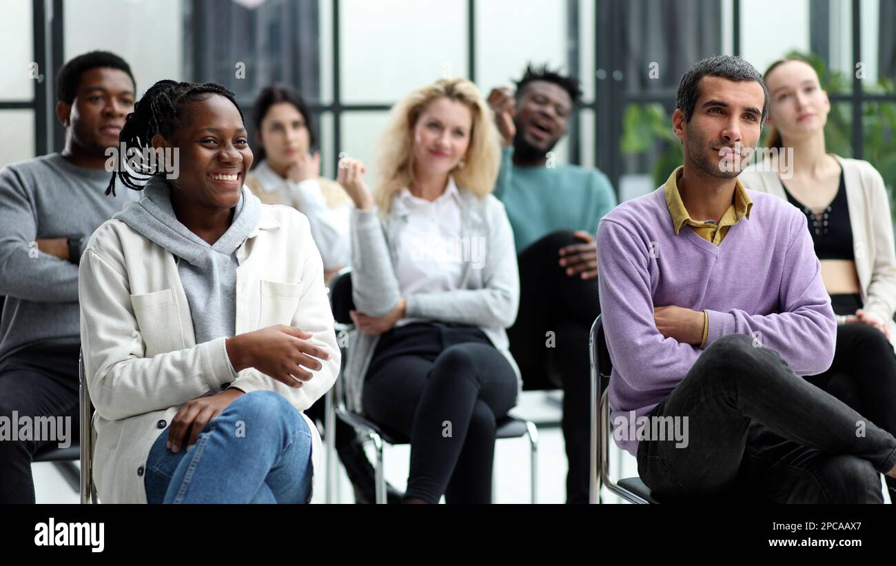 young people shaking hands in a circle of like-minded people Stock ...