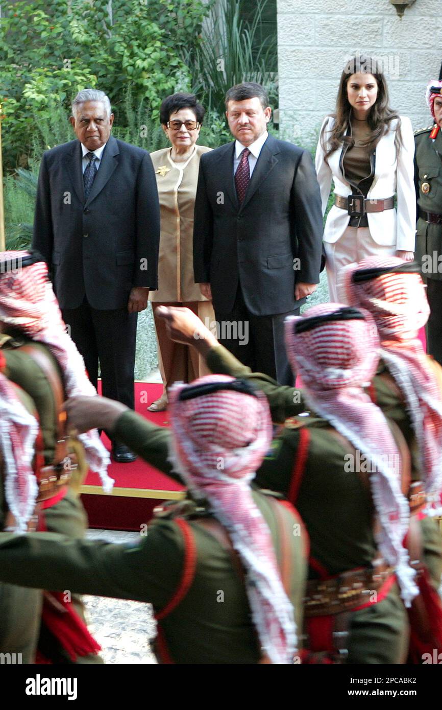 King Abdullah II of Jordan and his wife Queen Rania, right, reviews the ...