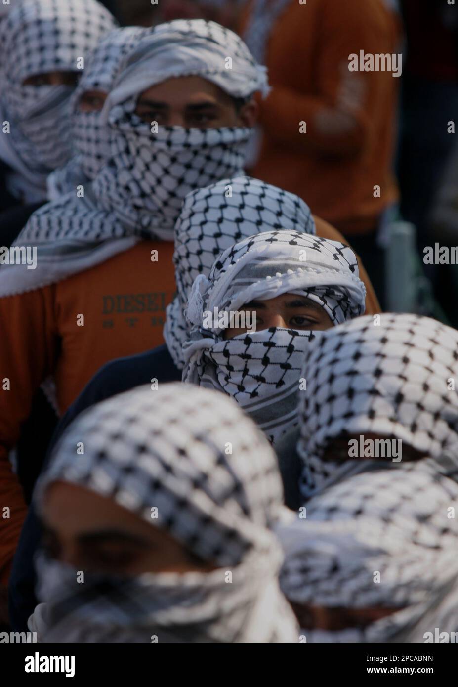 Fatah supporters march during a ceremony to commemorate the second ...