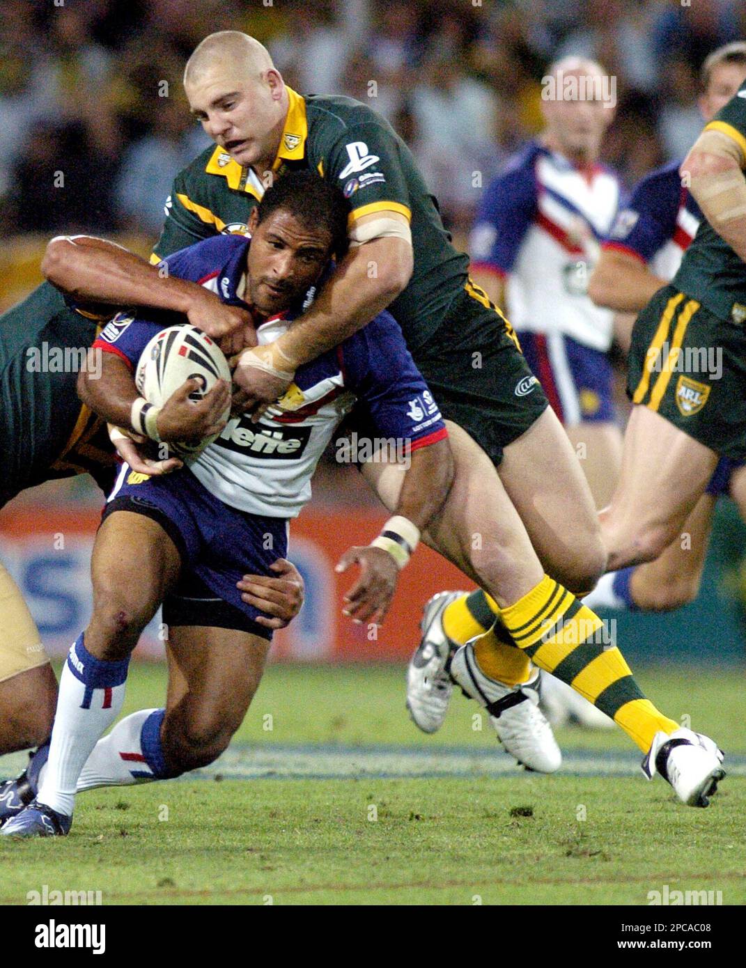 Australia's Mark O'Meley, right, tackles Gareth Raynor of Britain ...