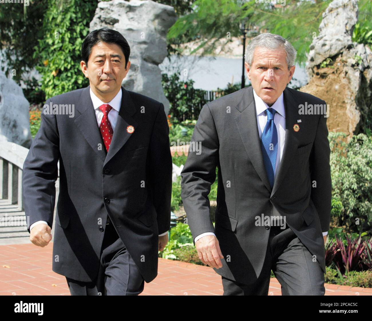 U.S. President George W. Bush, right, walks along with Japan's Prime ...