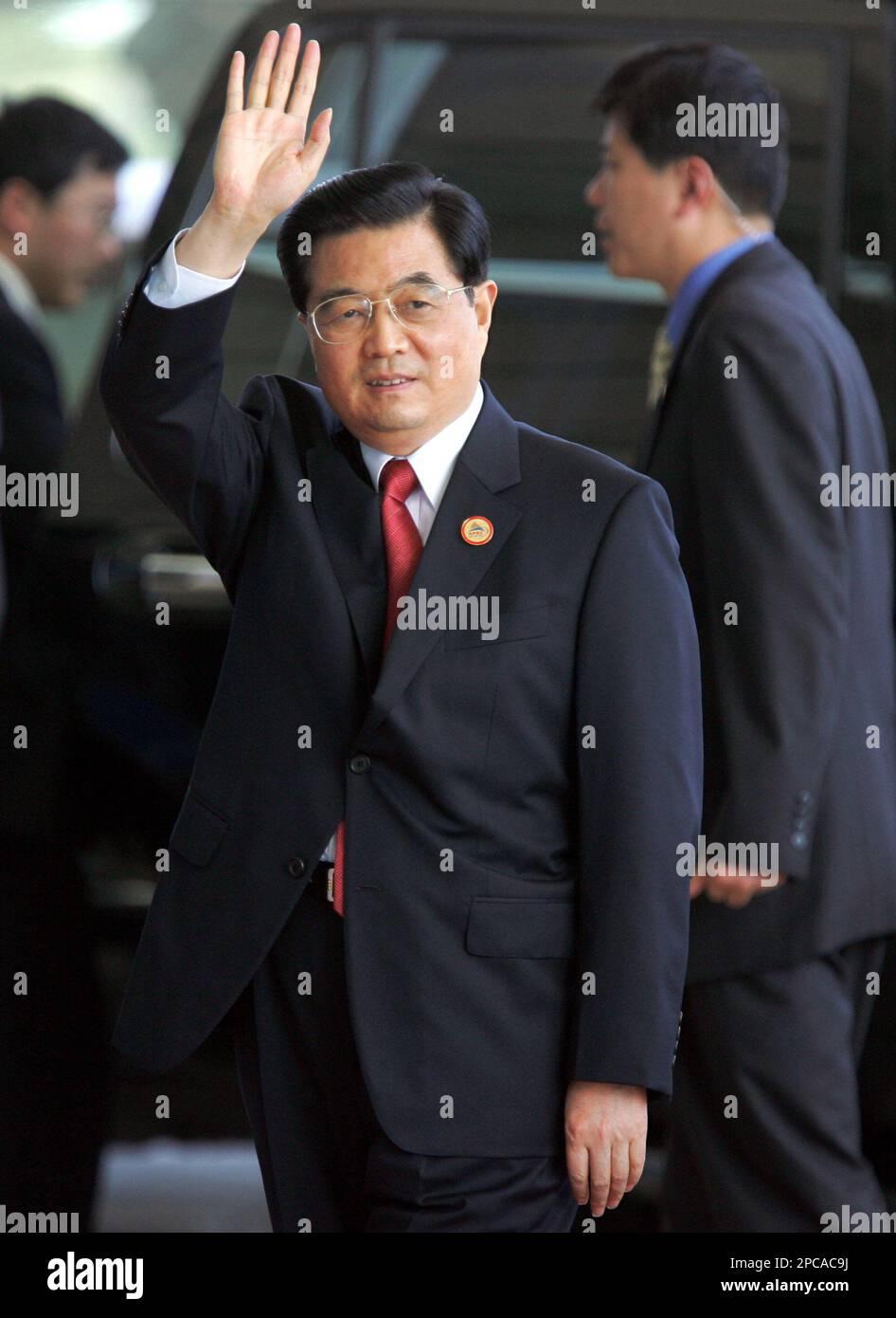 Chinese President Hu Jintao waves as he arrives at the National ...