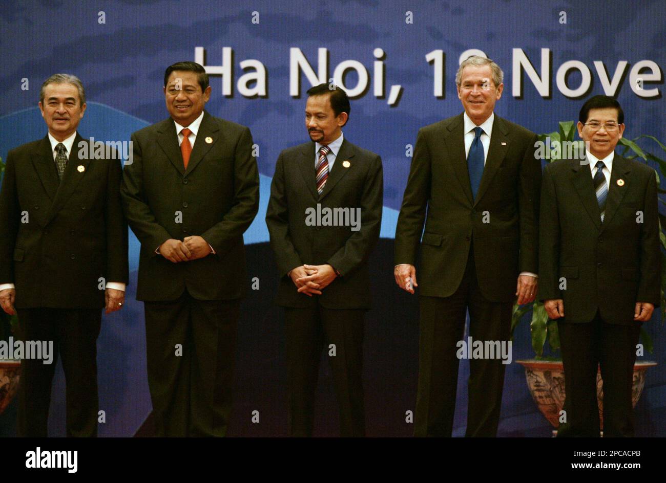 U.S. President George W. Bush, second right, poses for a photo with ...