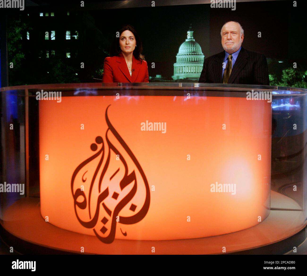 Al-Jazeera's English-language channel anchors Ghida Fakhry, left, and ...