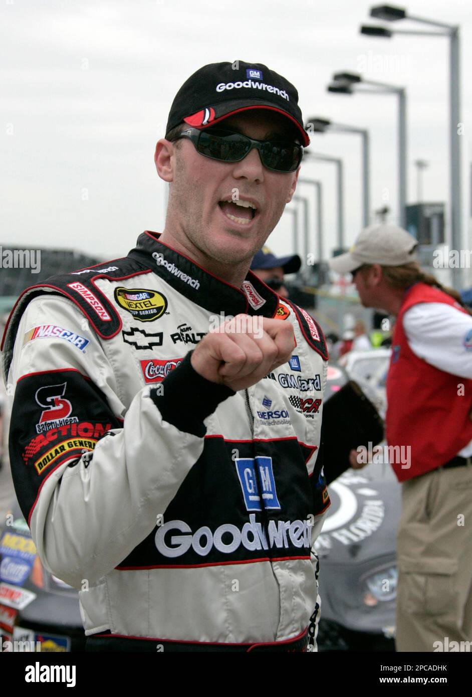 NASCAR driver Kevin Harvick talks with fans after his qualifying run ...