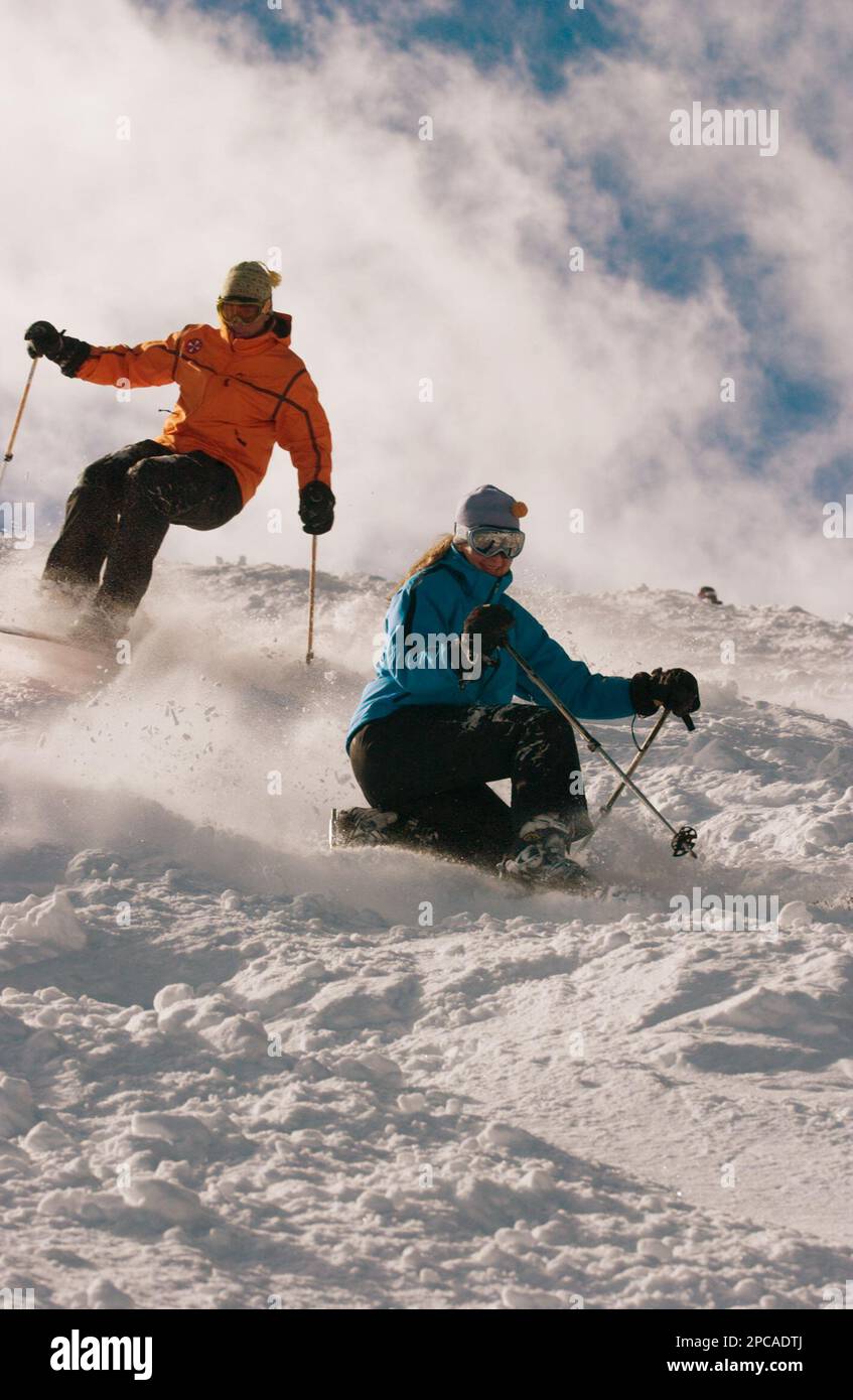 Henrietta and Eric Armbruster, left, of Vail, Colo., make telemark ...