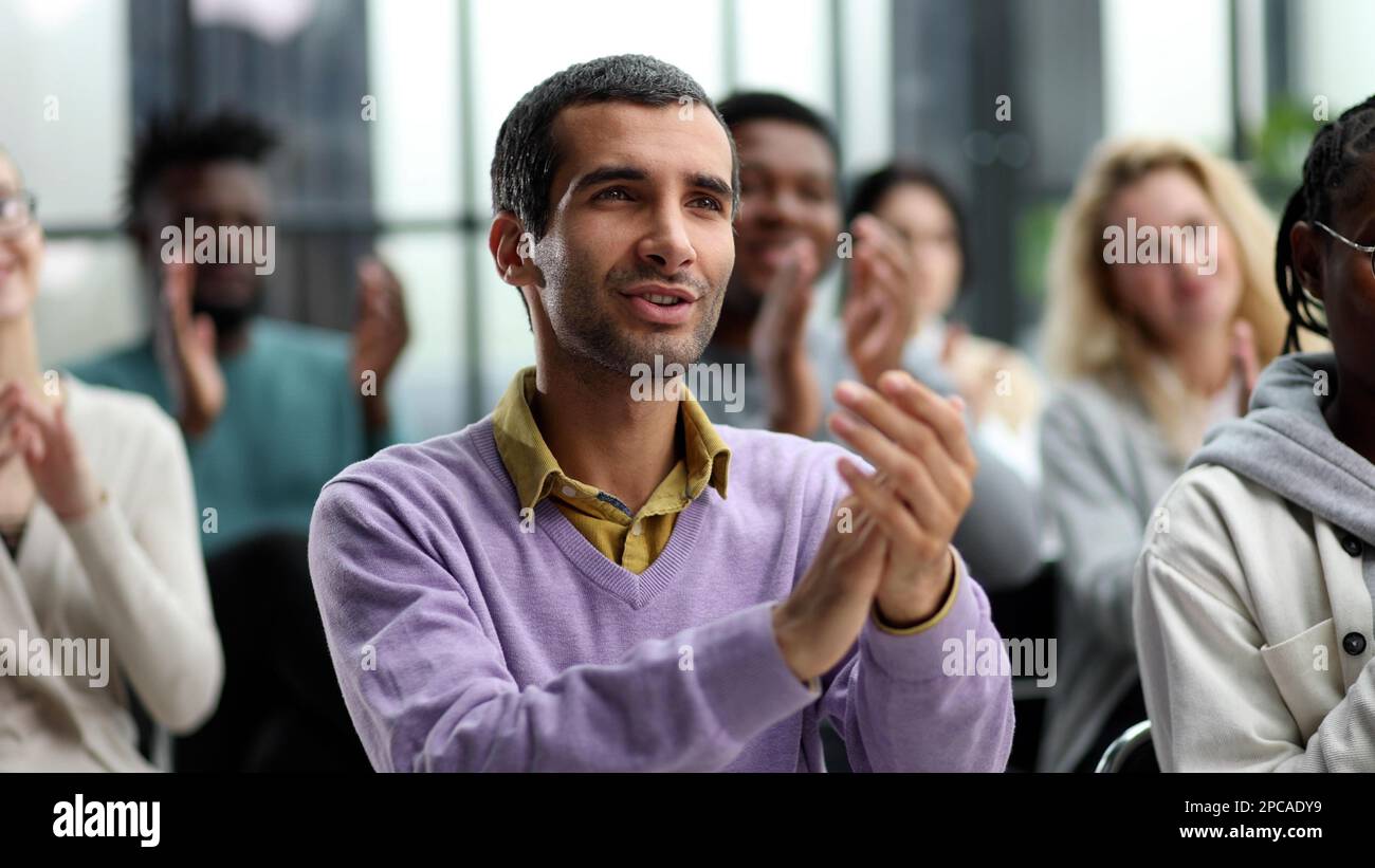 Seminar business meeting applause speaker. Crowded smiling audience ...