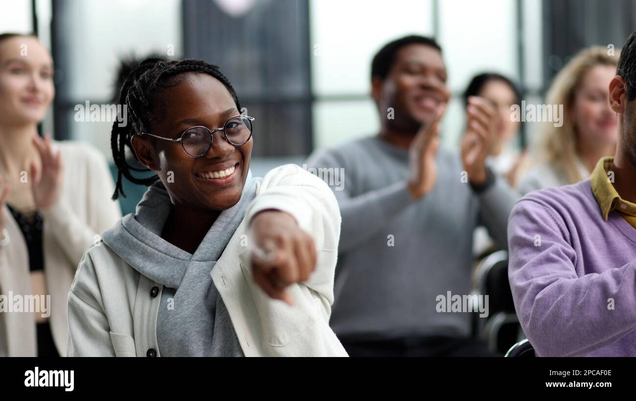 Young african woman pointing finger hi-res stock photography and images ...