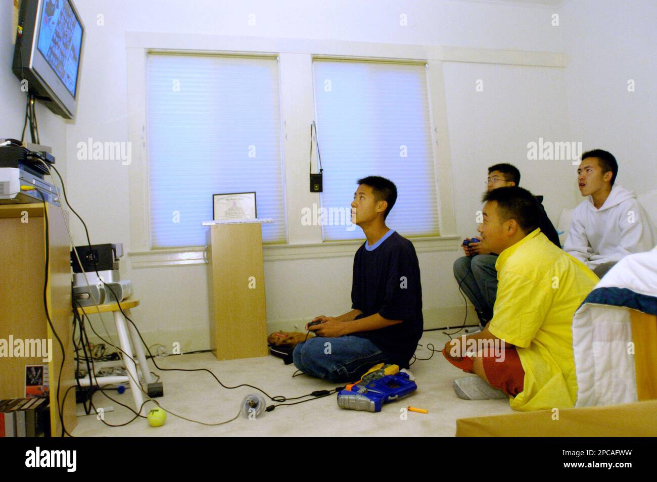 ** FILE ** A group of young Chinese-Americans play video games in ...