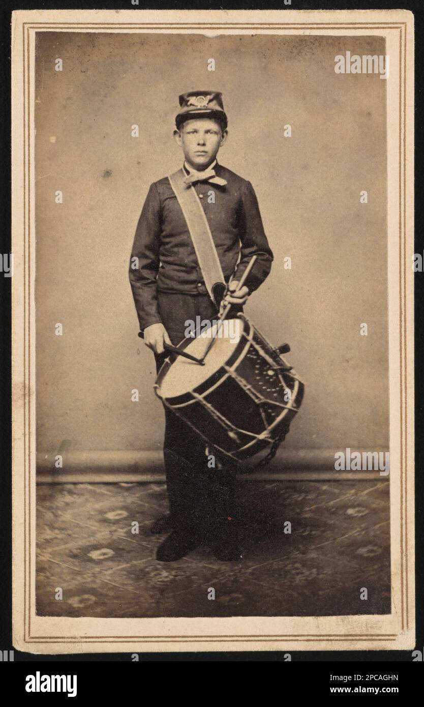 Unidentified young drummer boy in Union uniform playing drum ...