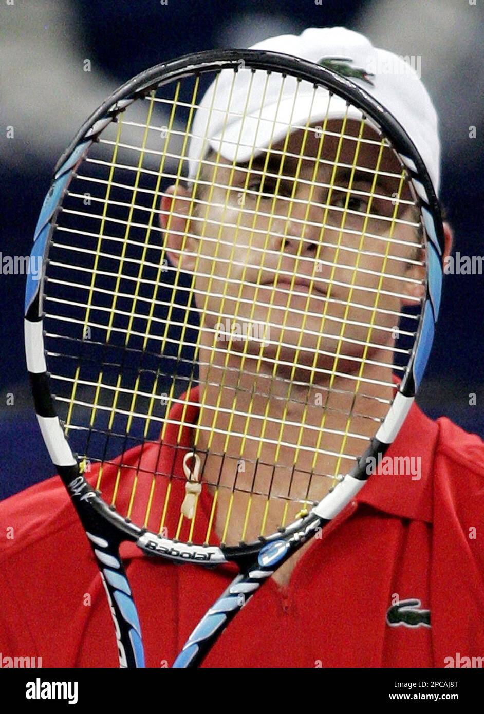 Andy Roddick of the United States reacts after he lost the first set ...