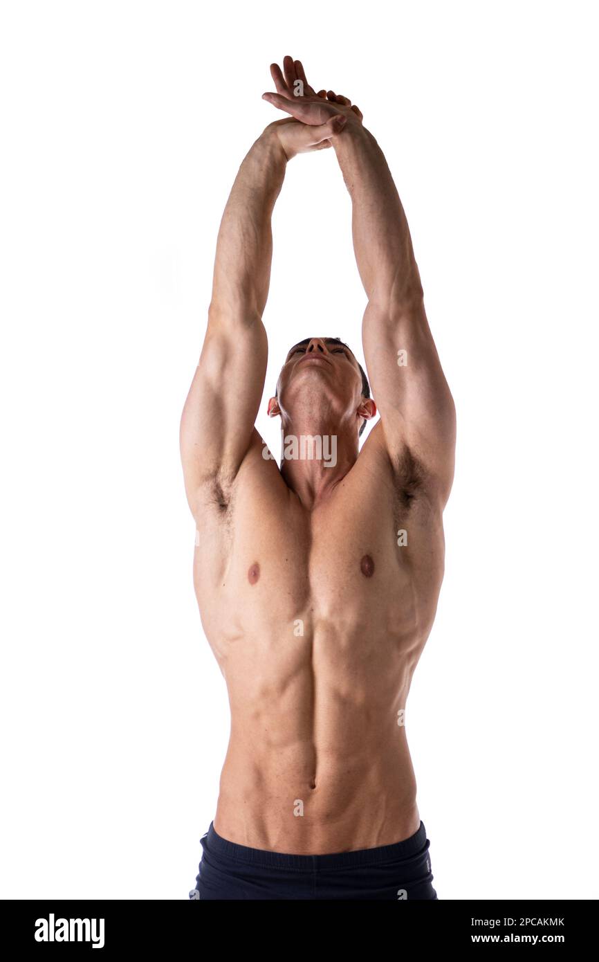 Handsome muscular shirtless young man stretching, in studio Stock Photo ...