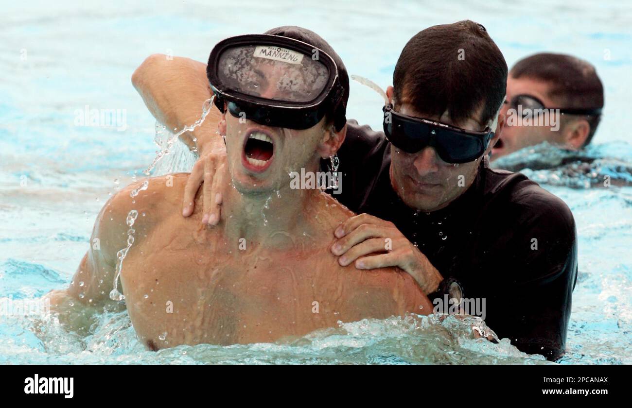 Captain James Manning is pushed back underwater by Capt. David Gray ...