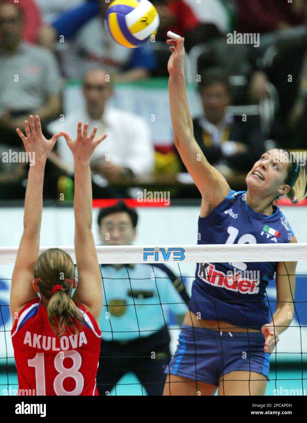 Francesca Piccinini of Italy, right, spikes the ball against Marina ...