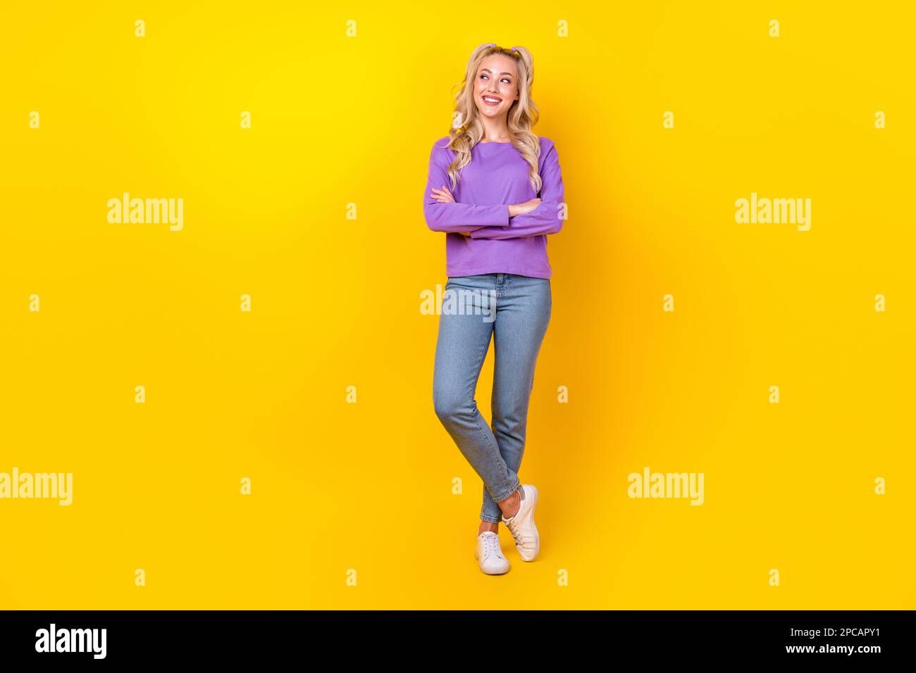 Full body photo of attractive young woman folded arms look empty space ...