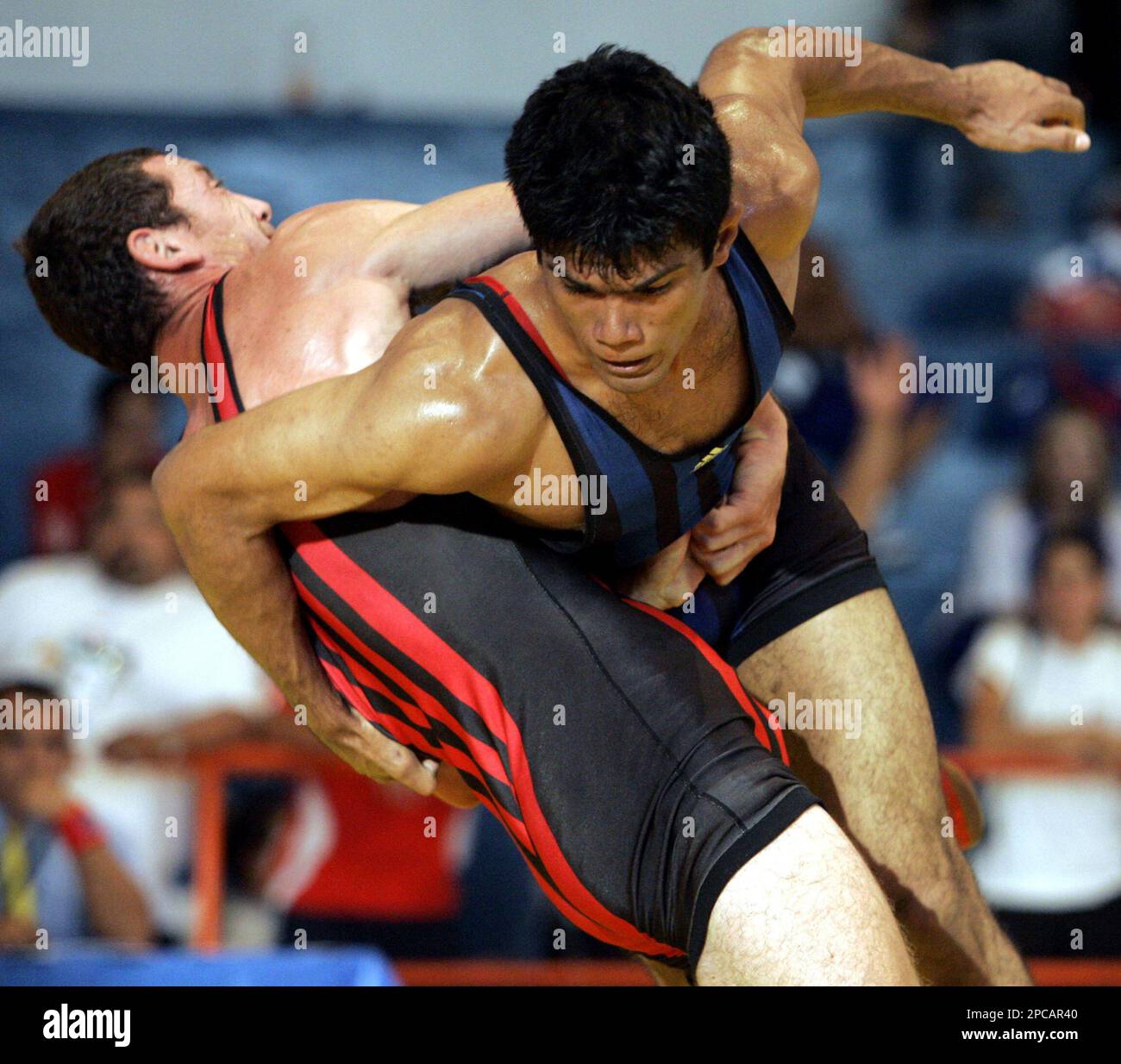 Panama's Samuel Arroyo, left, and Argentina's Federico De La Pena wrestle during the 84kg Greco ...