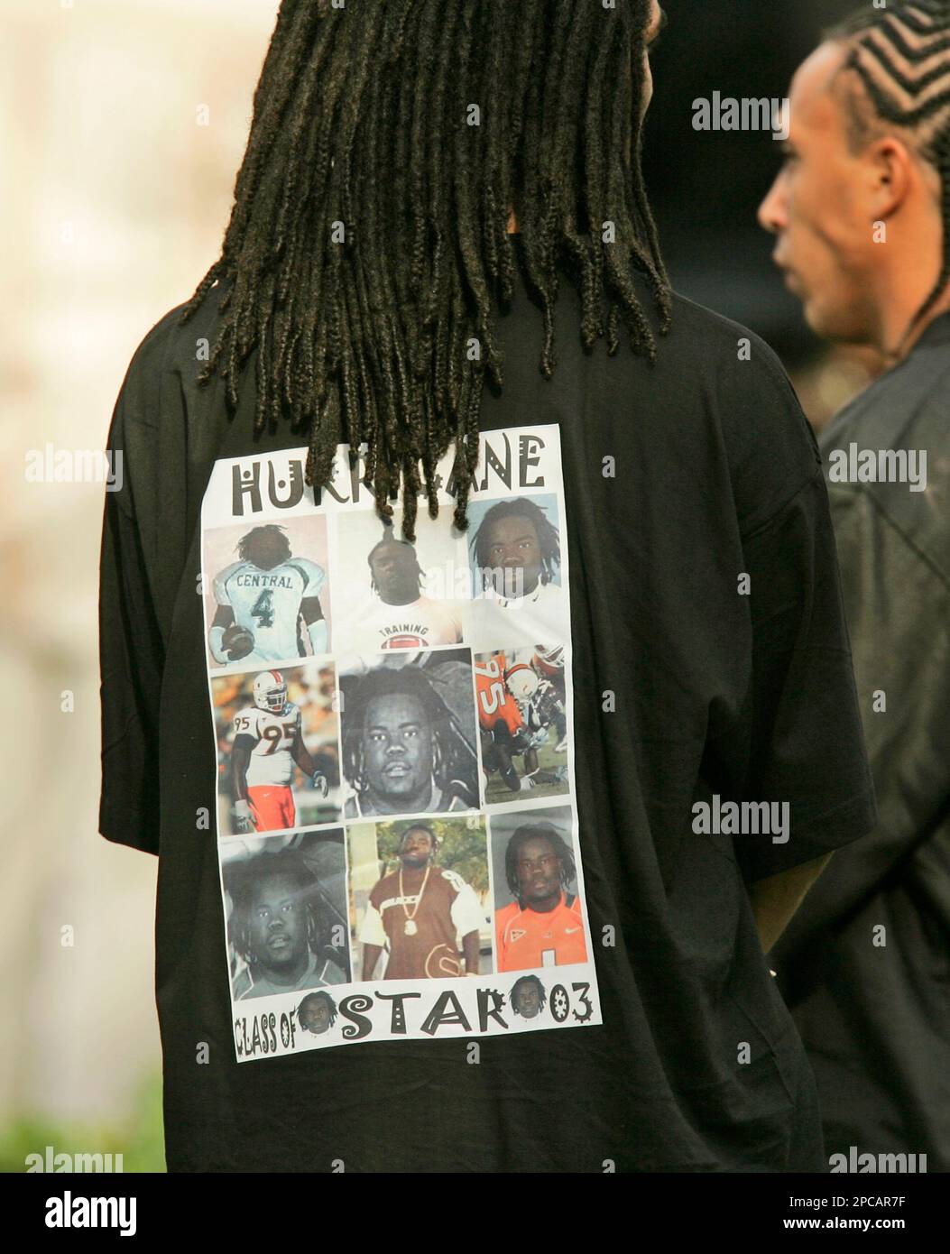 An man wears a t-shirt in memory of Miami defensive lineman Bryan Pata ...