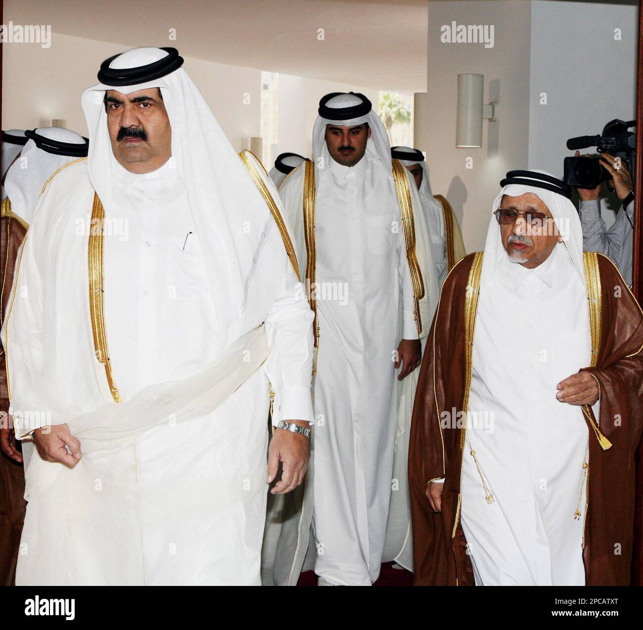 Qatar's Emir Shaikh Hamad Bin Khalifa Al-Thani, left, arrives with ...