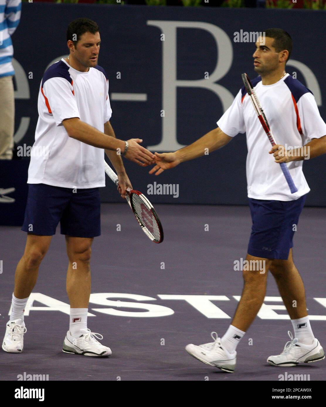 Israel's Andy Ram, right, and partner Johnathan Erlich react during a ...