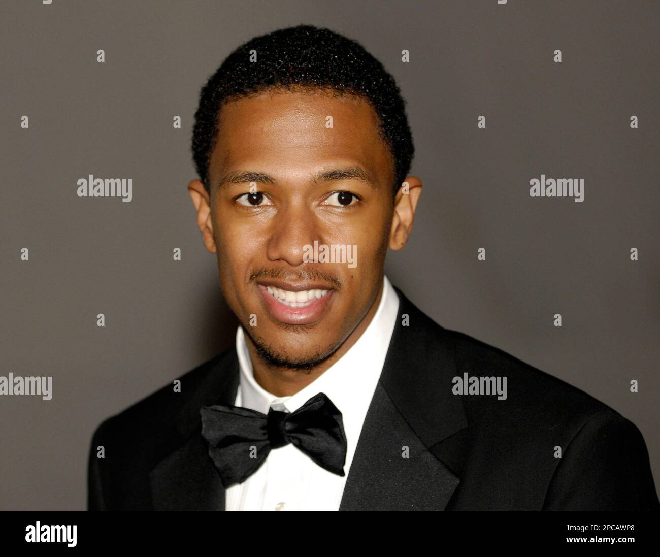 Entertainer Nick Cannon smiles as he arrives on the red carpet for the ...