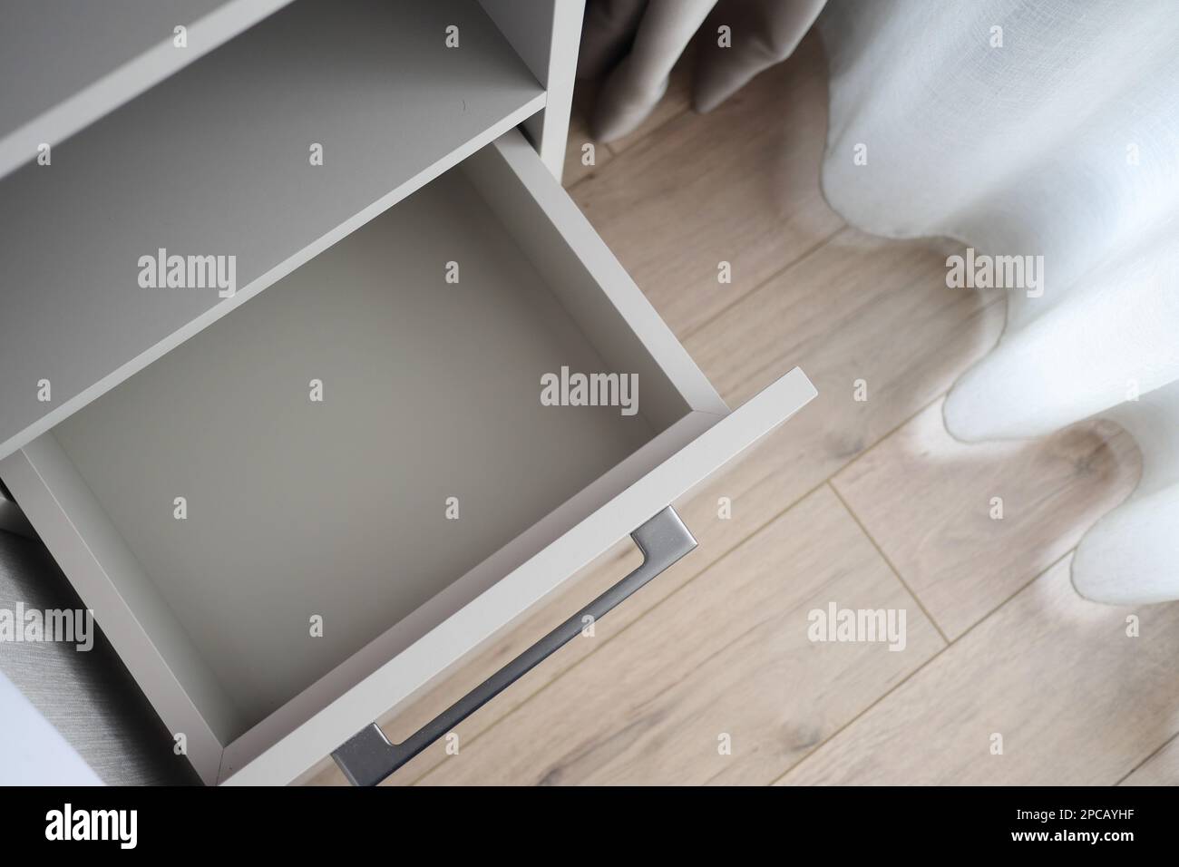 Opened kitchen drawer in room, top view Stock Photo - Alamy