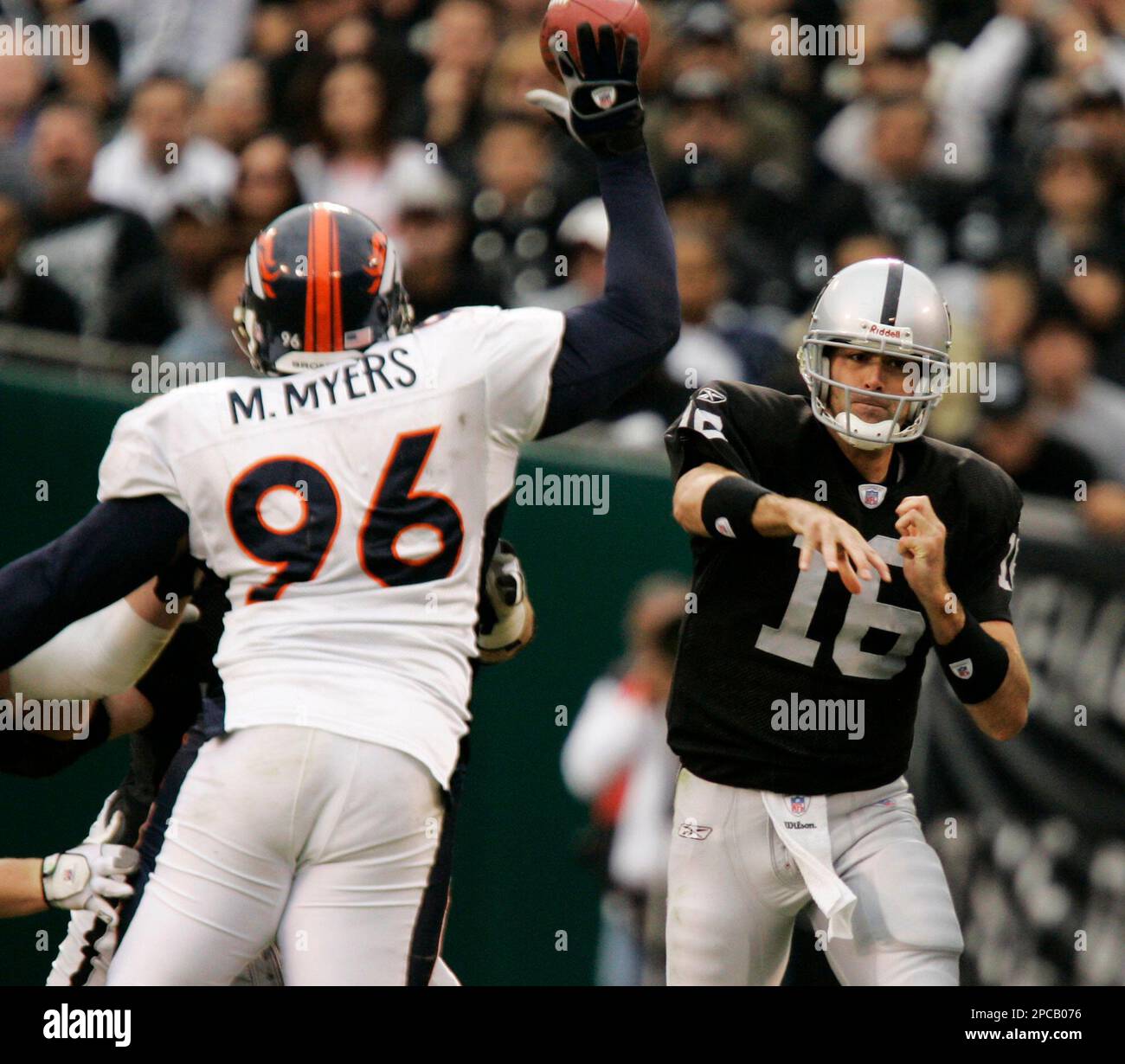 Oakland Raiders quarterback Andrew Walter, right, throws over the ...