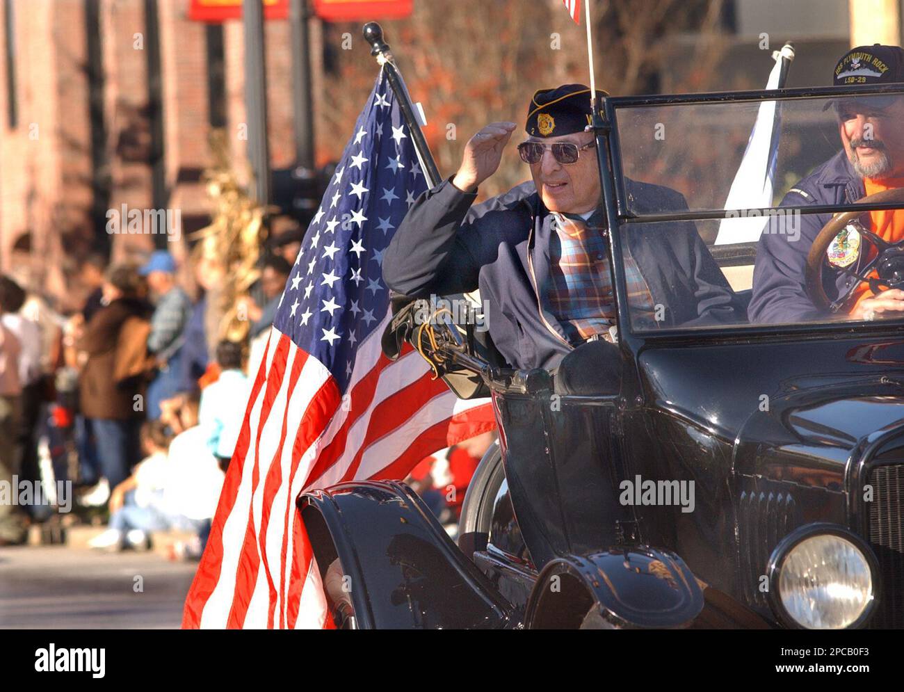 Richard Garner, left, a U.S. Navy World War II veteran, rides with ...