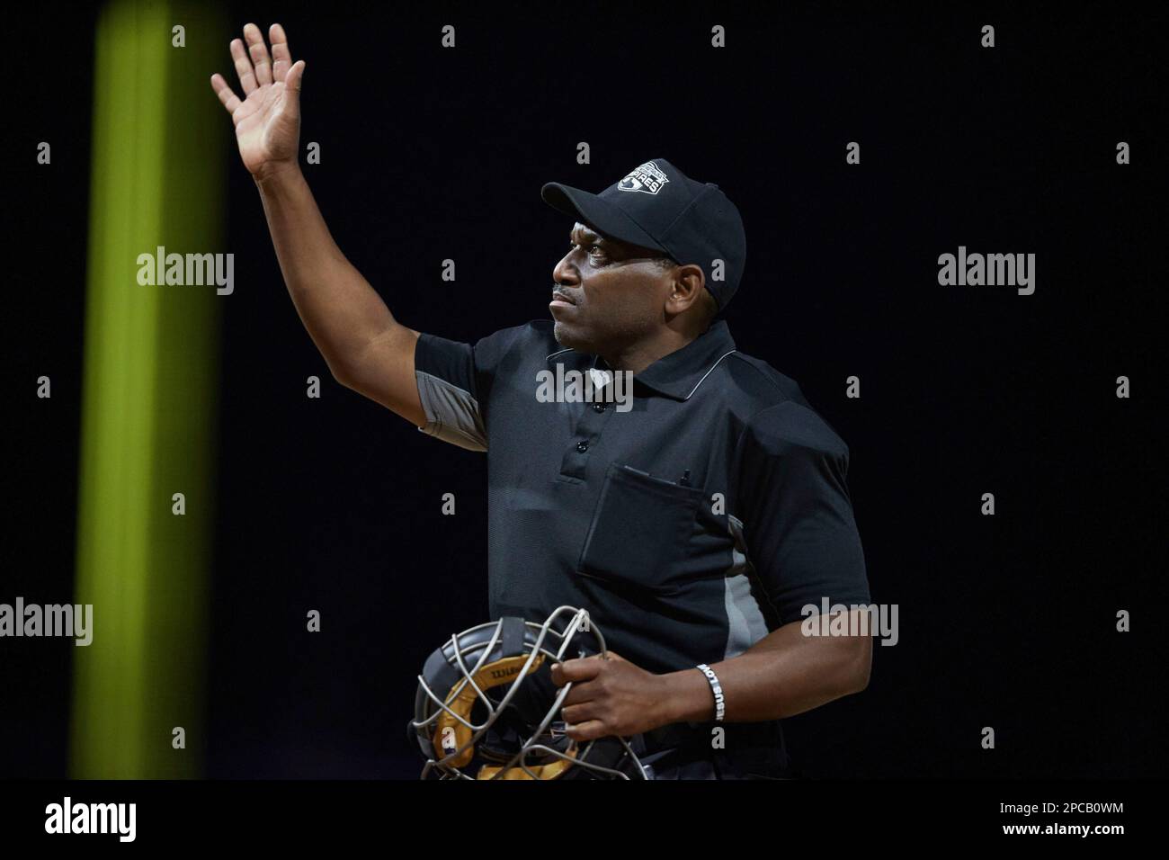 Home plate umpire Marcus Neal makes works the NCAA baseball game ...