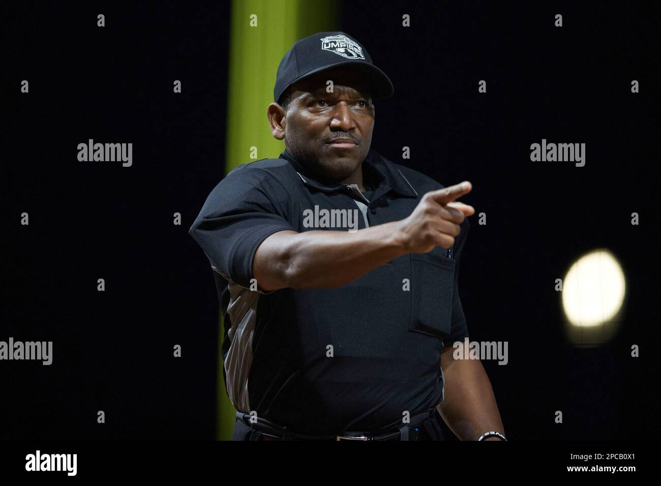 Home plate umpire Marcus Neal makes works the NCAA baseball game ...
