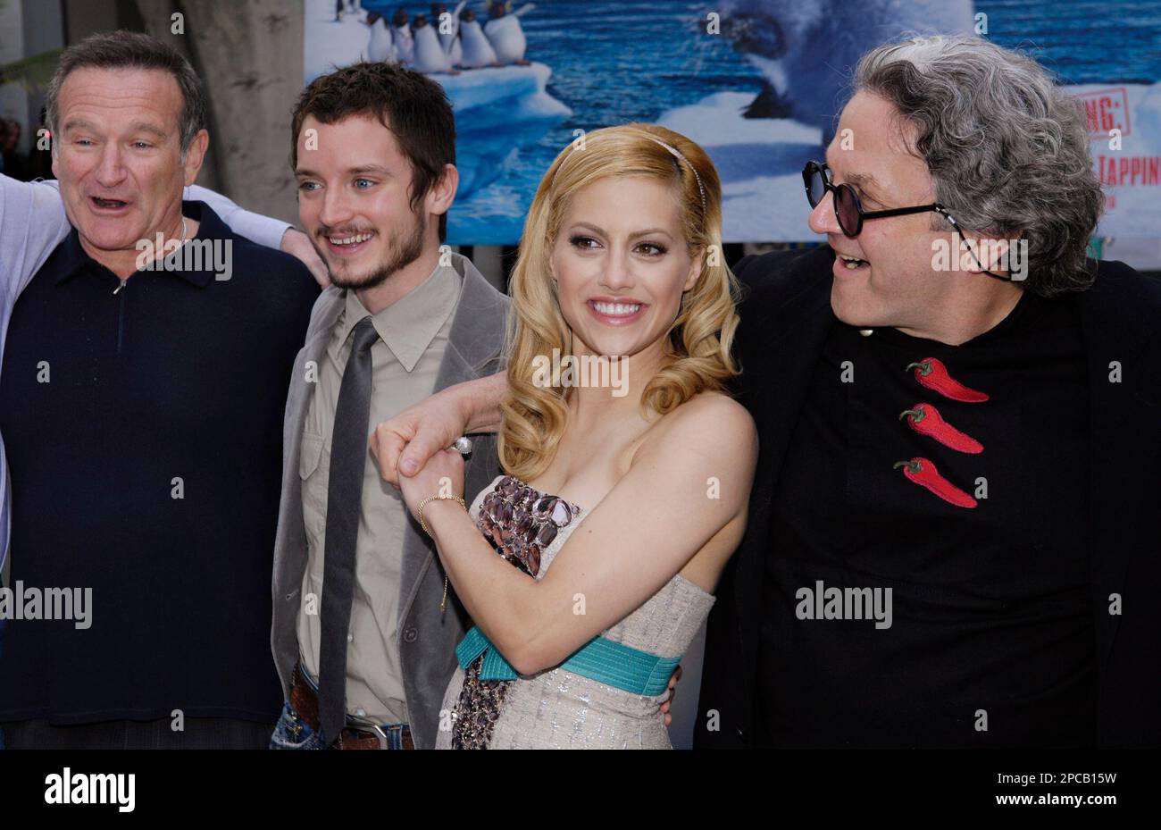 George Miller, right, director of the animated film "Happy Feet," poses ...