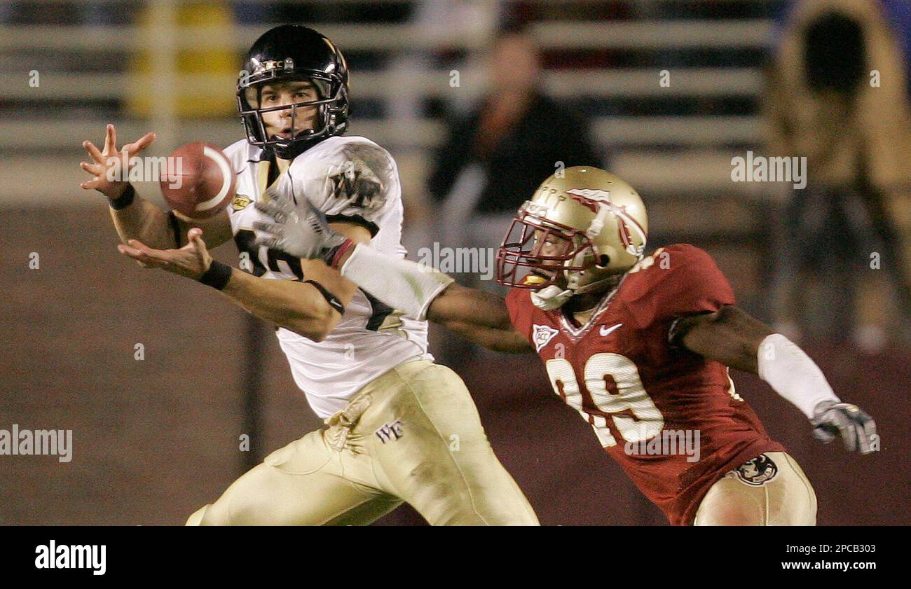 Wake Forest receiver Nate Morton, left, makes a fourth-quarter catch as ...