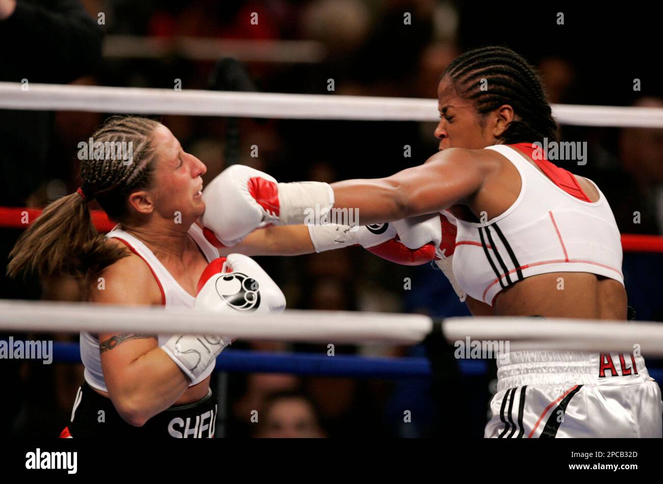 Laila Ali, right, punches Shelly Burton during the second round of ...